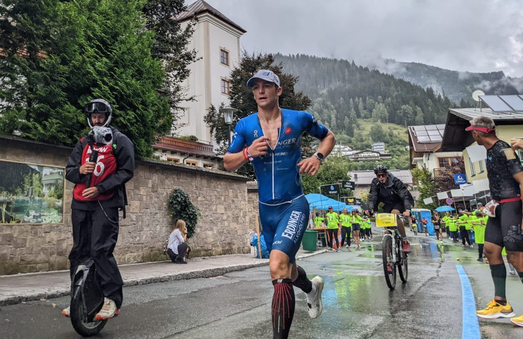 Frederic Funk celebrates the win at rainy Ironman 70.3 Zell am See ...
